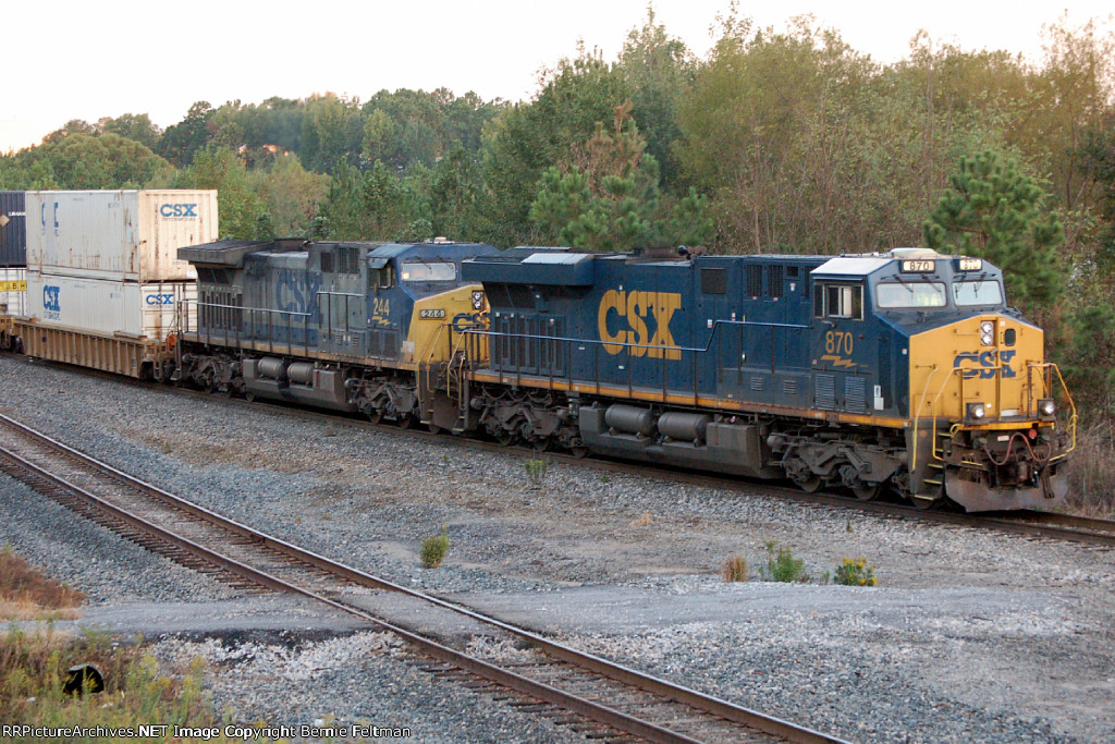 CSX ES44AC #870 and AC44CW #244 pull a Lineville Subdivision double-stack up to the yard office ...